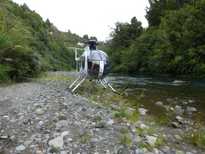 Helicopter beside a river. Photo: Sarah Ridsdale. | Conservation blog